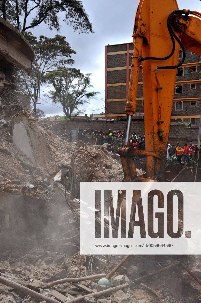NAIROBI, Oct. 20, 2009 An excavator grabs the remains of a collapsed ...
