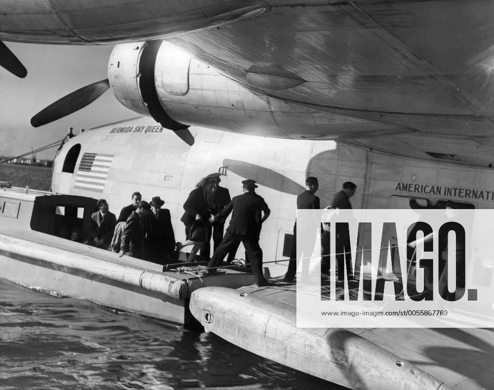 Passengers boarding a flying boat the Bermuda Sky Queen leaving Poole ...