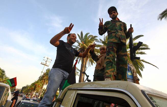 Libyan National Transitional Council (NTC) fighters celebrate in the ...