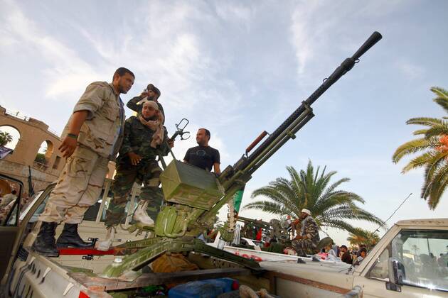 Libyan National Transitional Council (NTC) fighters celebrate in the ...