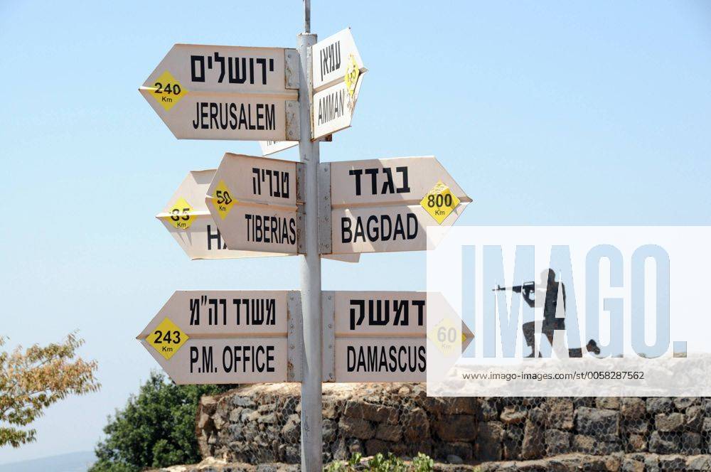 A sign showing different distances, including Damascus, stands near an ...