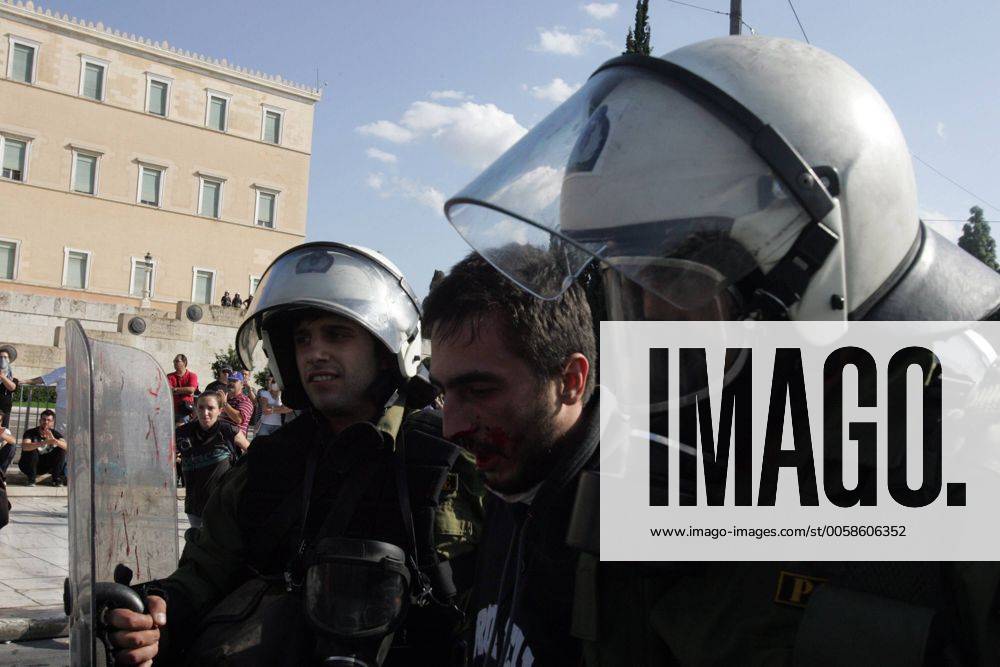 ATHENS, Oct. 18, 2012 A protestor is arrested by riot police in Greek ...