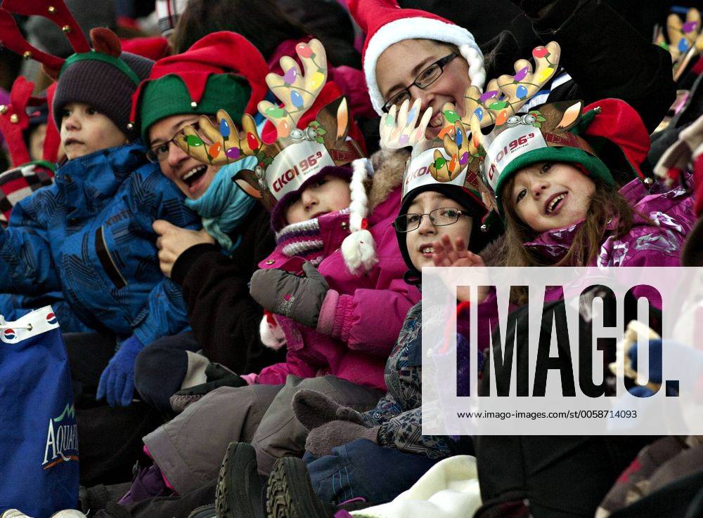 Audiences gesture during a Santa Claus parade in Montreal, Canada, Nov ...