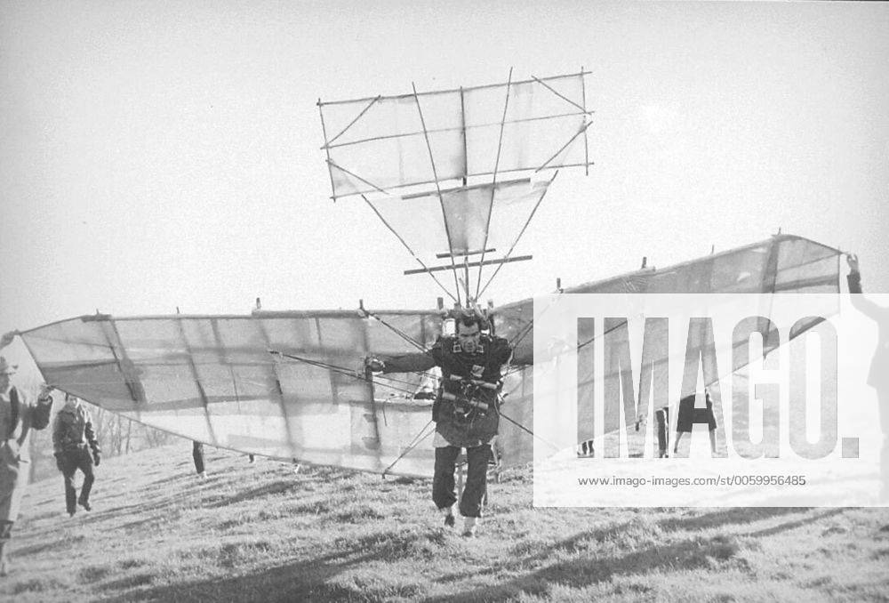 A man attempting to fly with attached wings