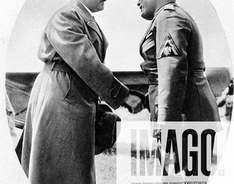 Hitler shaking hands with Mussolini on his arrival in Venice