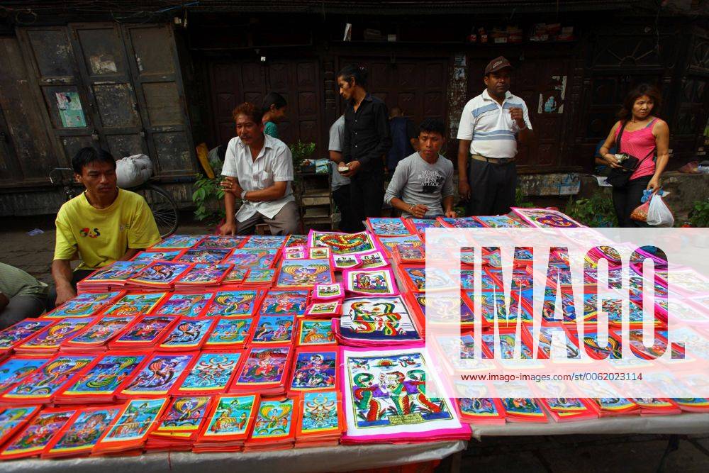 (140731) -- KATHMANDU, July 31, 2014 -- Local vendors sell pictures of ...