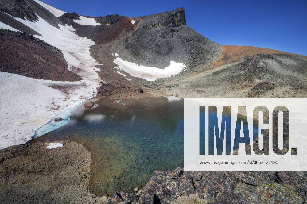 Alpine lake in the volcanic Itcha Mountains of British Columbia Canada
