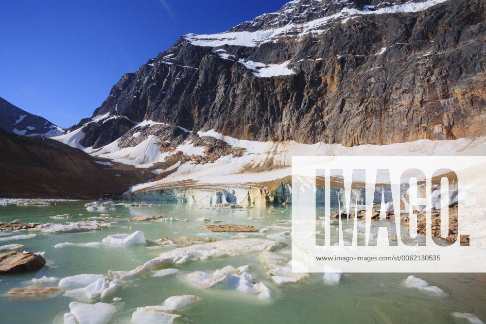 Ice chunks calving off Cavell Glacier into Cavell Pond, Jasper National ...