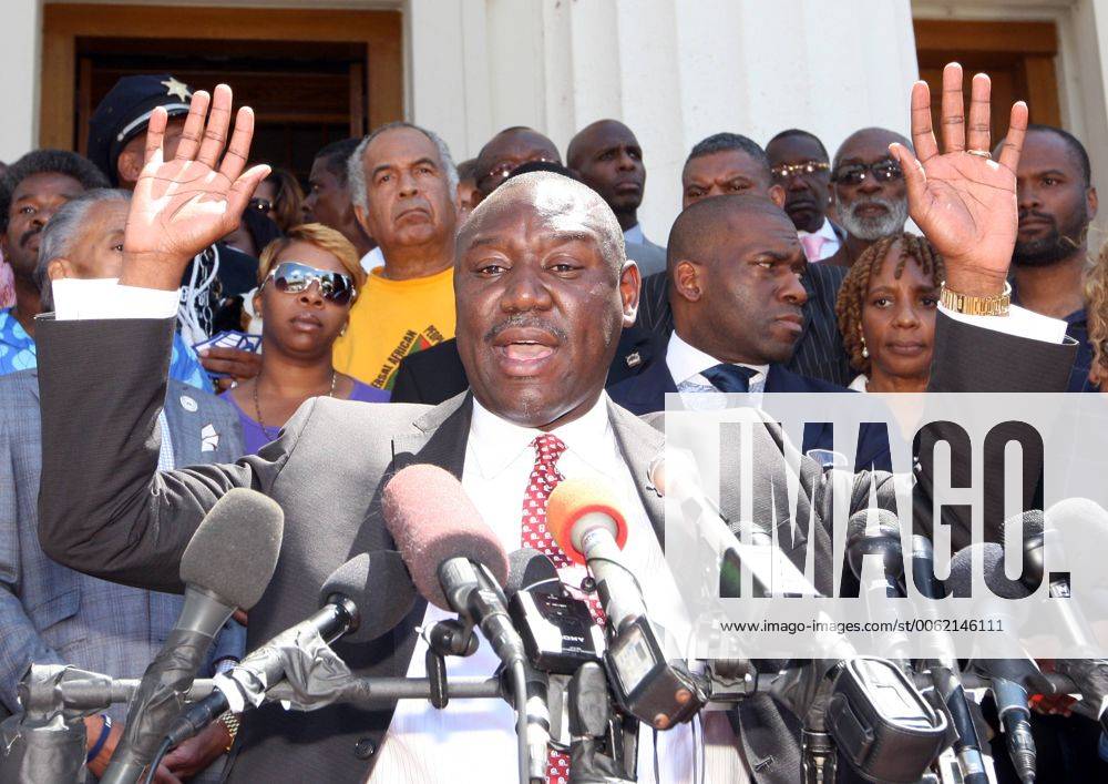 Attorney Benjamin L. Crump throws his hands up during a press ...
