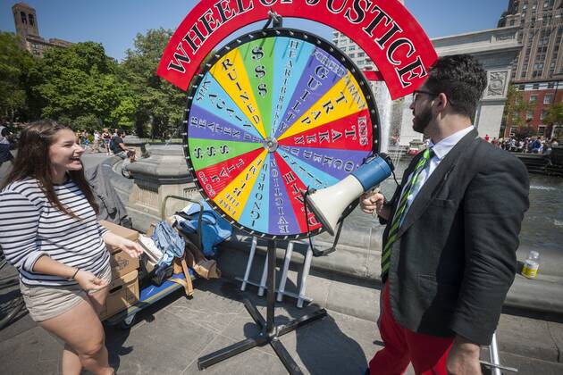 NYCLU volunteer Evan Altshuler armed with a bullhorn acts as master of ...