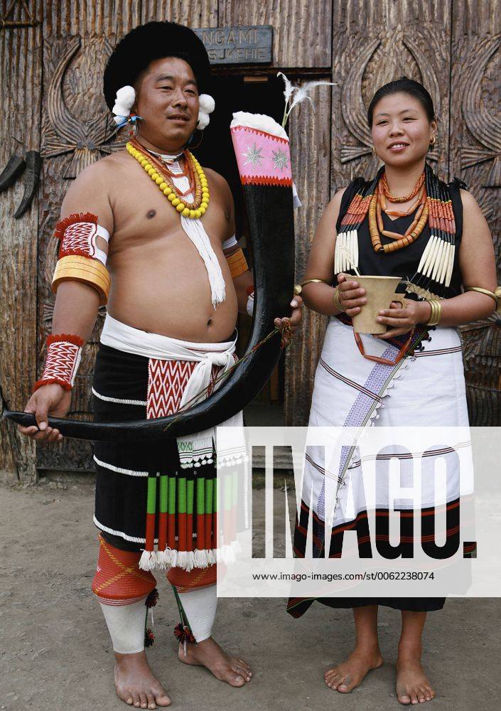 A Naga couple of the Angami Tribe in their traditional attire from ...