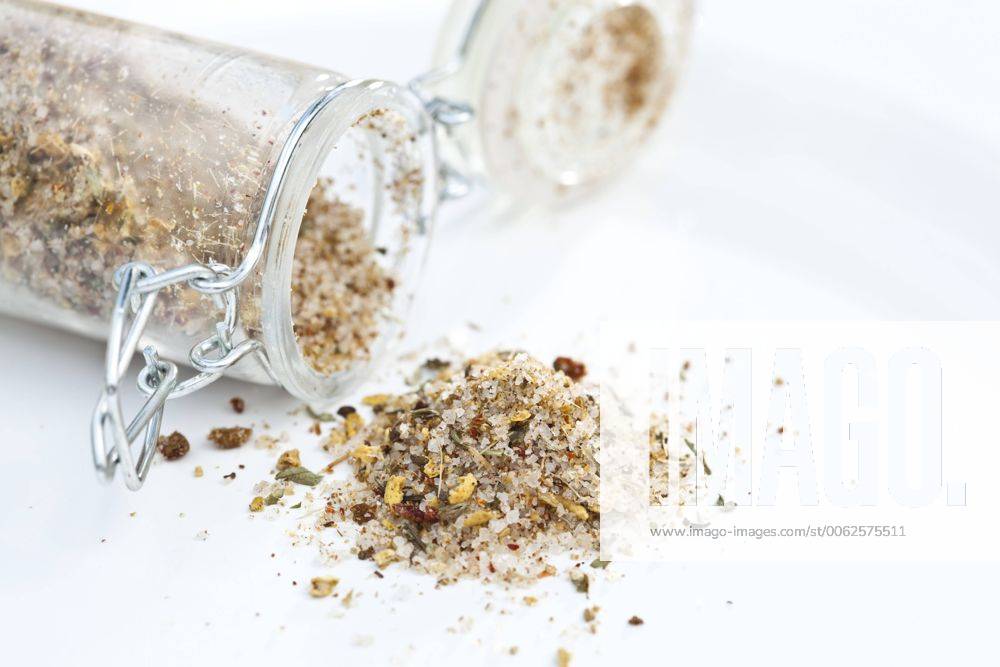 Germany, Duesseldorf, Mixed spices with salt in glass jar, close up
