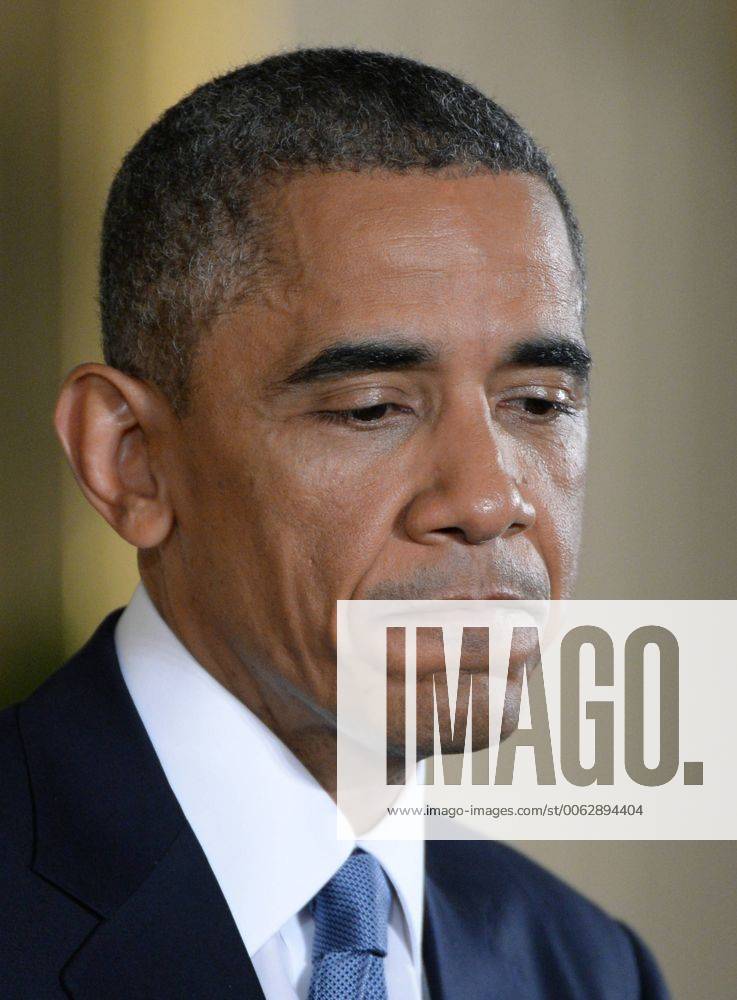 President Barack Obama reflects as he makes a comment during a press ...