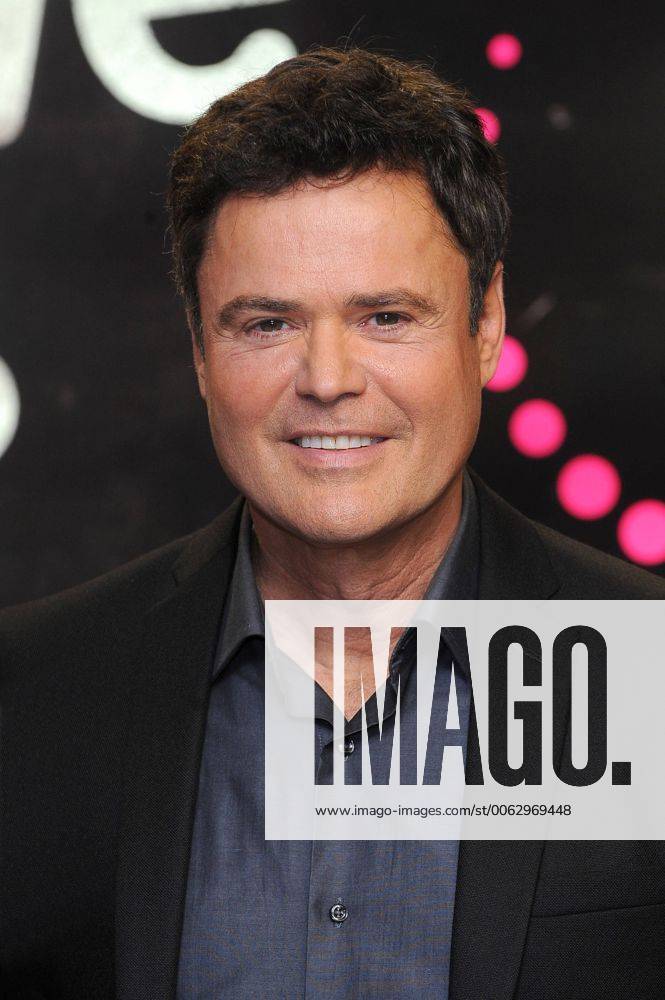 American singer Donny Osmond is pictured signing copies of his new ...