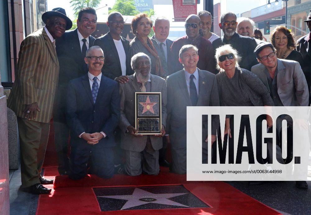 Dick Gregory (1st row, C) and a group including George Lopez, Tommy Davidson, Dr. E. Faye Williams