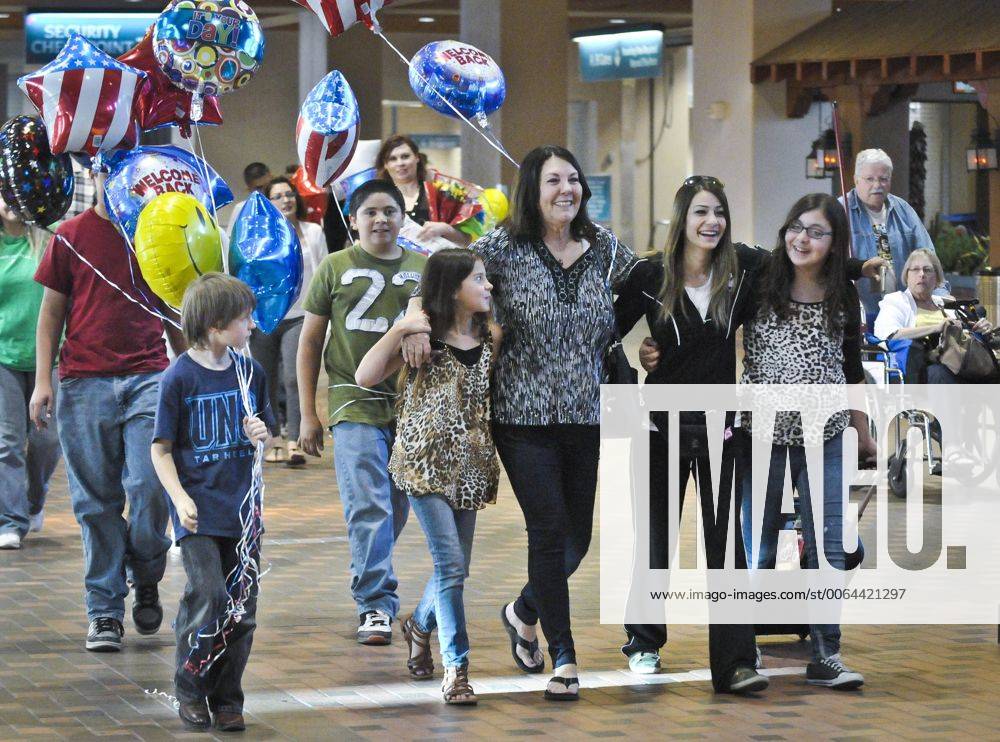 Albuquerque, NM, U.S. - 042815.Robbie Lamb, third from right, walks arm ...