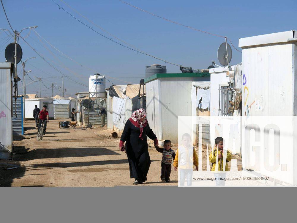 Syrian mother, child at refugee camp in Jordan A Syrian mother and her ...