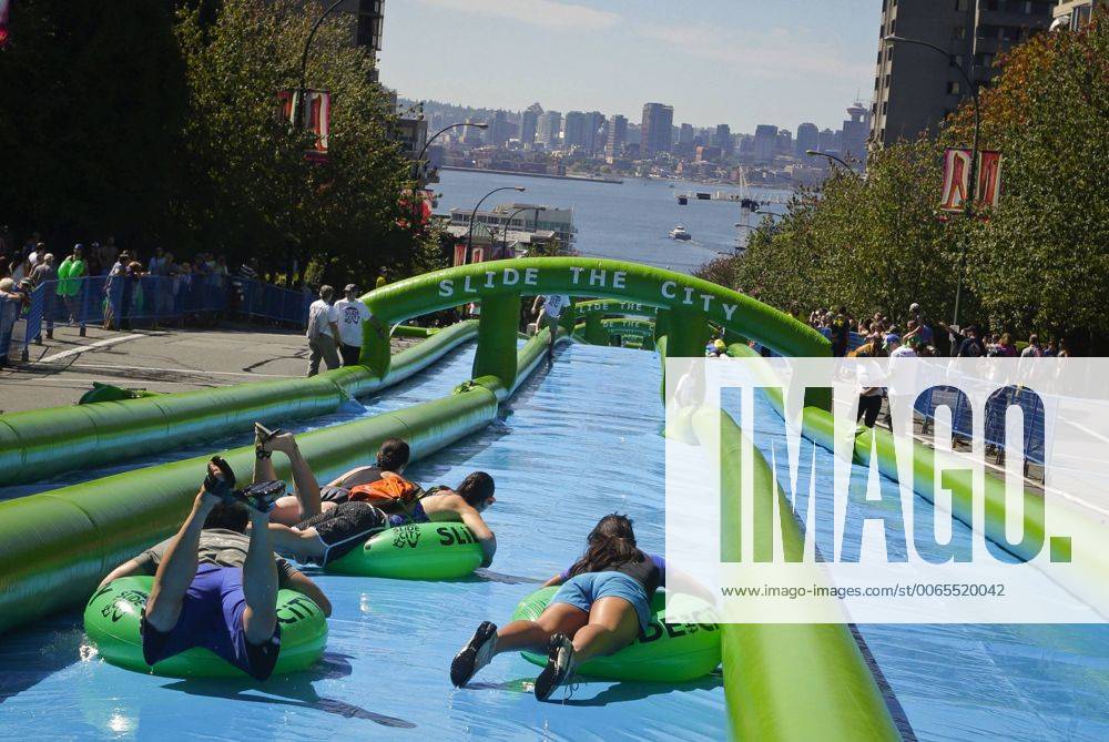 Participants slide down the 330-metres long slide during the Slide the ...