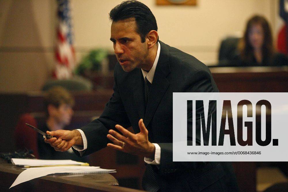 July 26, 2012 - San Antonio, USA - Prosecutor Christopher Ramos uses the knife used in the stabbing