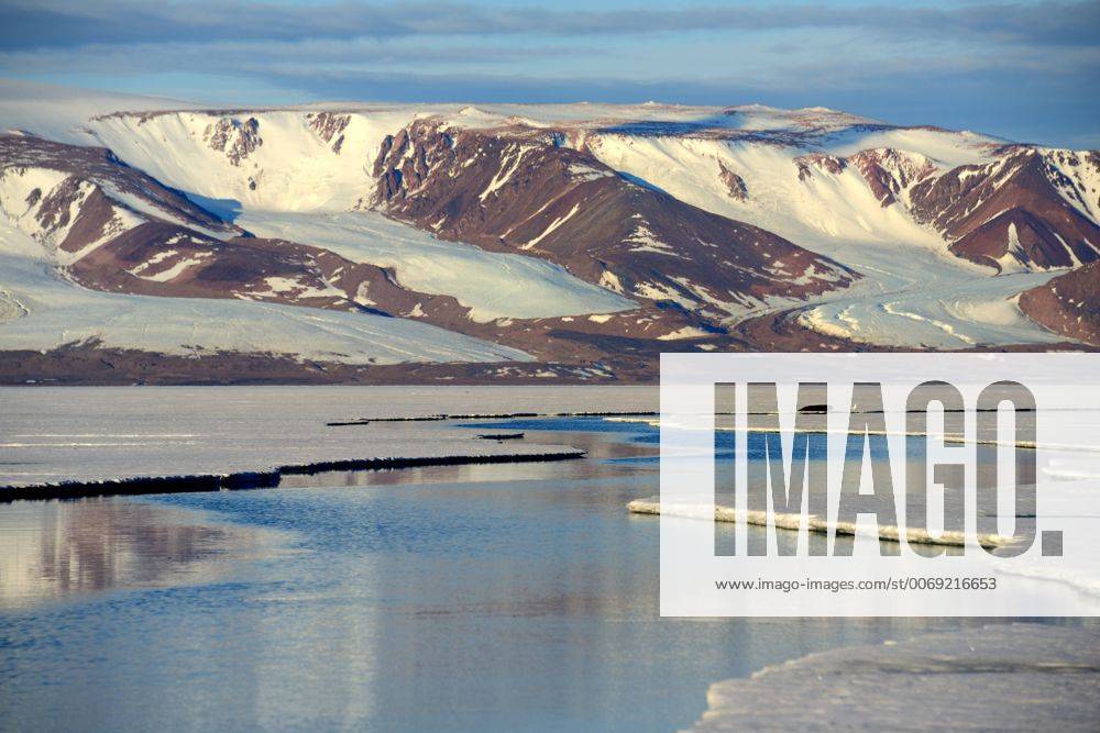 Crack in the pack ice, Manson Icefield peninsula and Jakeman glacier ...
