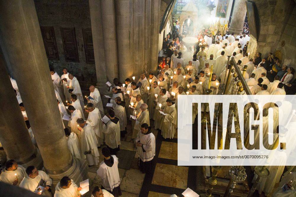 Jerusalem, ISRAEL - Clergymen are pictured during a procession around the Stone of Anointing during