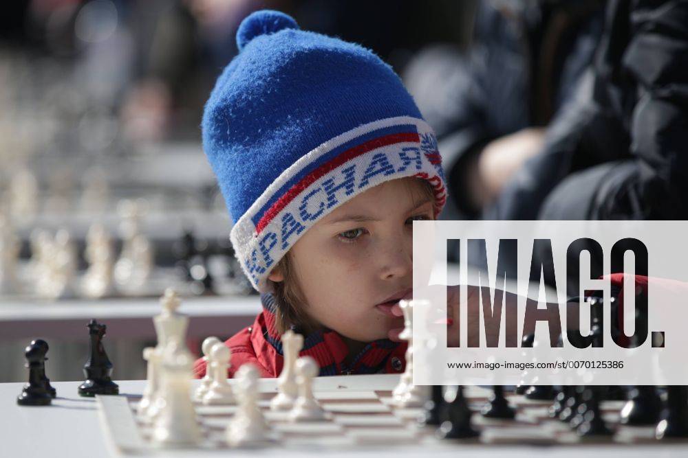 MOSCOW, RUSSIA. A girl playing chess during a festival held as part of ...