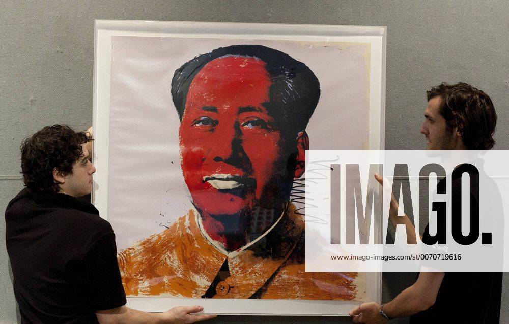 July 8, 2011 - London, England, United Kingdom - Bonhams staff hang pictures by Andy Warhol at the