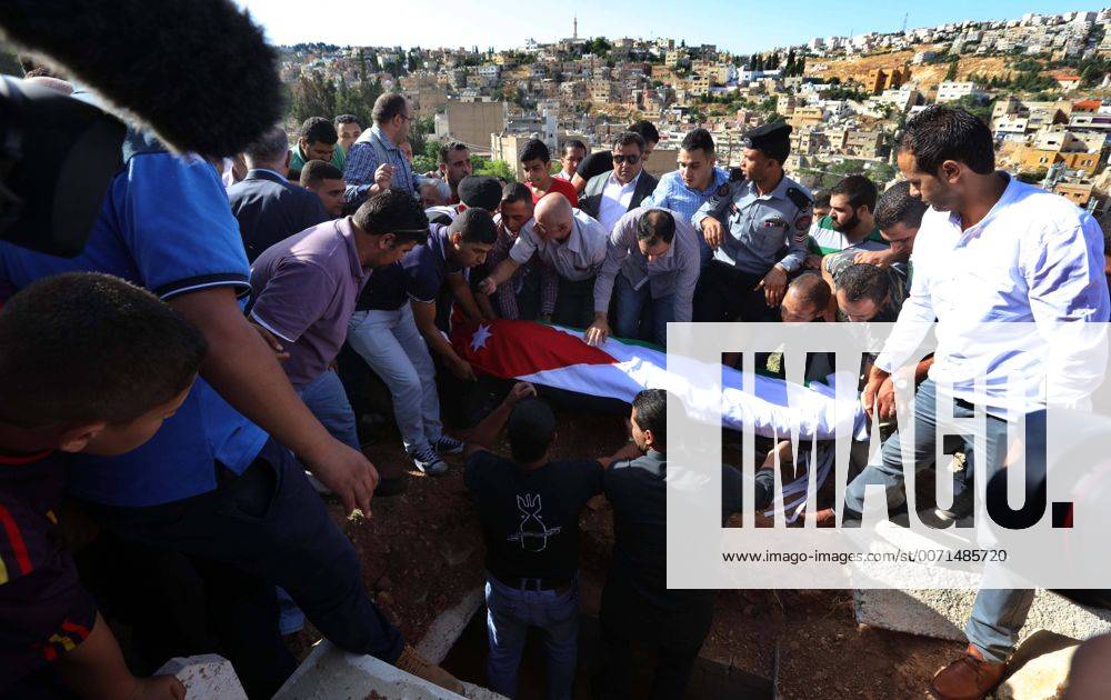 AMMAN, Jordanian soldiers carry the coffin of a Jordanian intelligence ...
