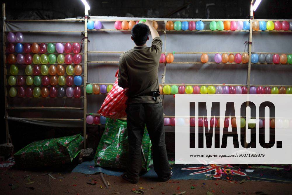 Feb 24, 2010 - Shenzhen, Guangdong, China - A vendor places balloons ...