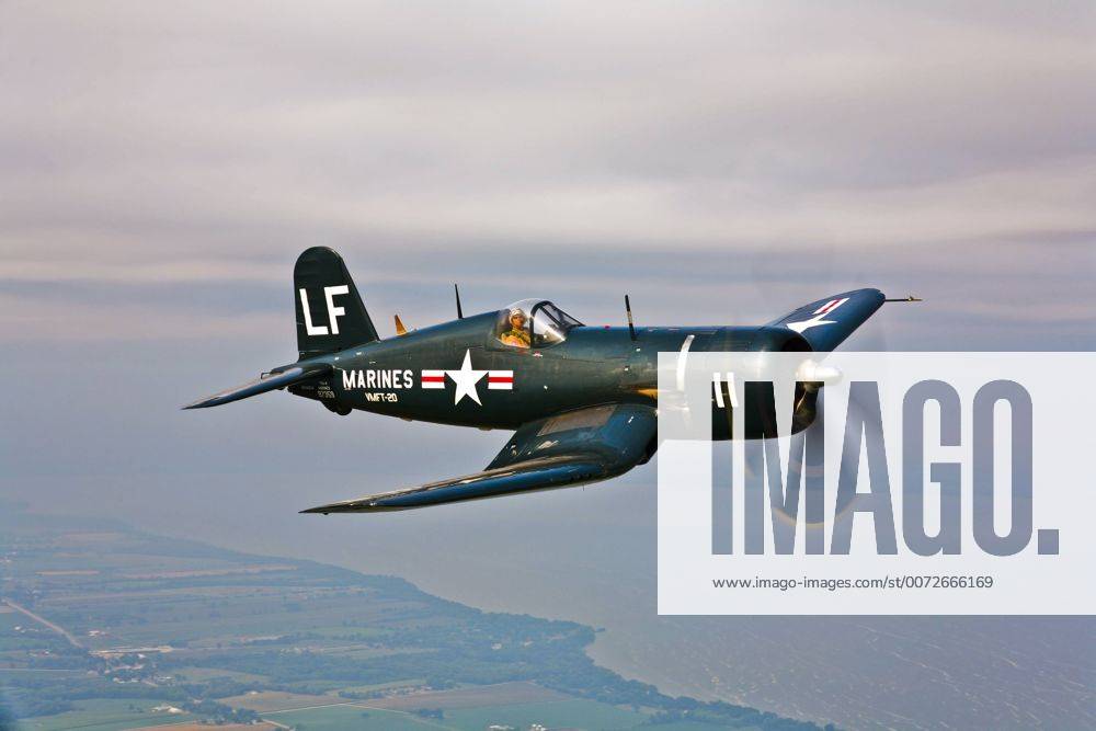 A Vought F4U-4 Corsair in Korean War markings of VMFT-20, flying over ...