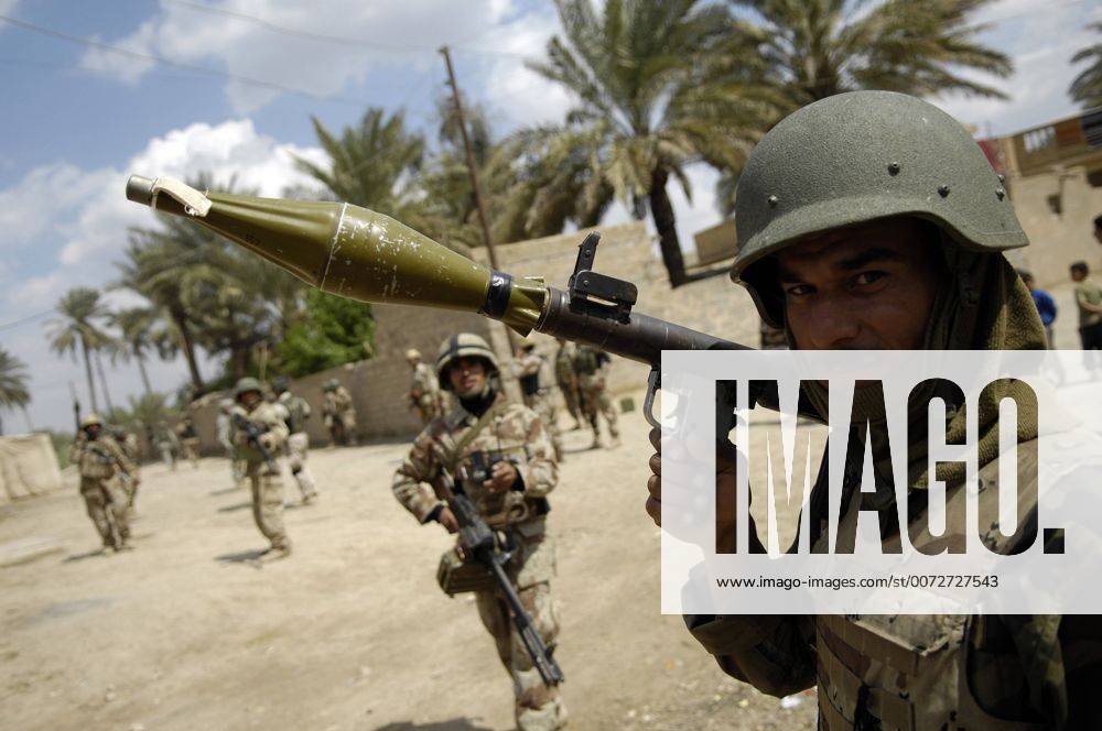 An Iraqi army soldier provides security with a rocket-propelled grenade ...