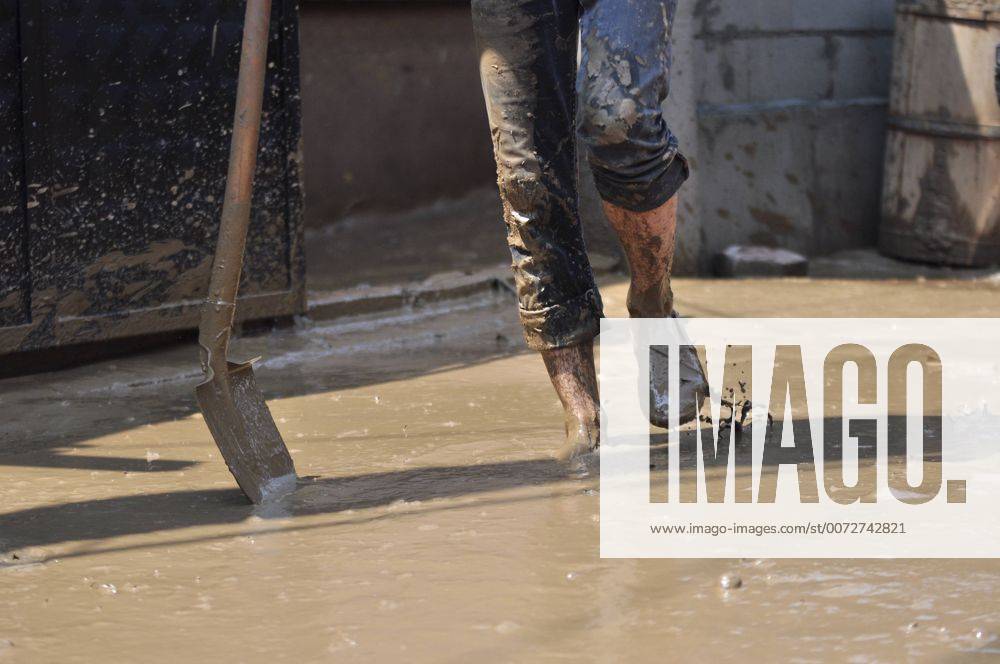 Unwetter in Mazedonien Skopje, Macedonia - A man stands in mud in the ...