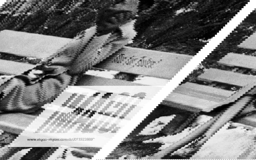 Antisemitism in Nazi Germany 1938: woman hides her face while sitting ...