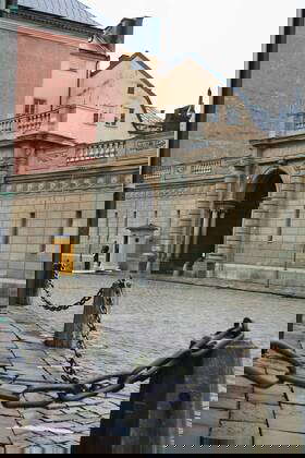 Stockholm, Sweden - An old world road and buildings. There is a chained ...