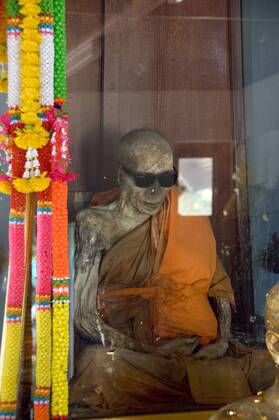 Thailand, Ko Samui . Khunaram Temple. Mummified remains of Buddhist ...