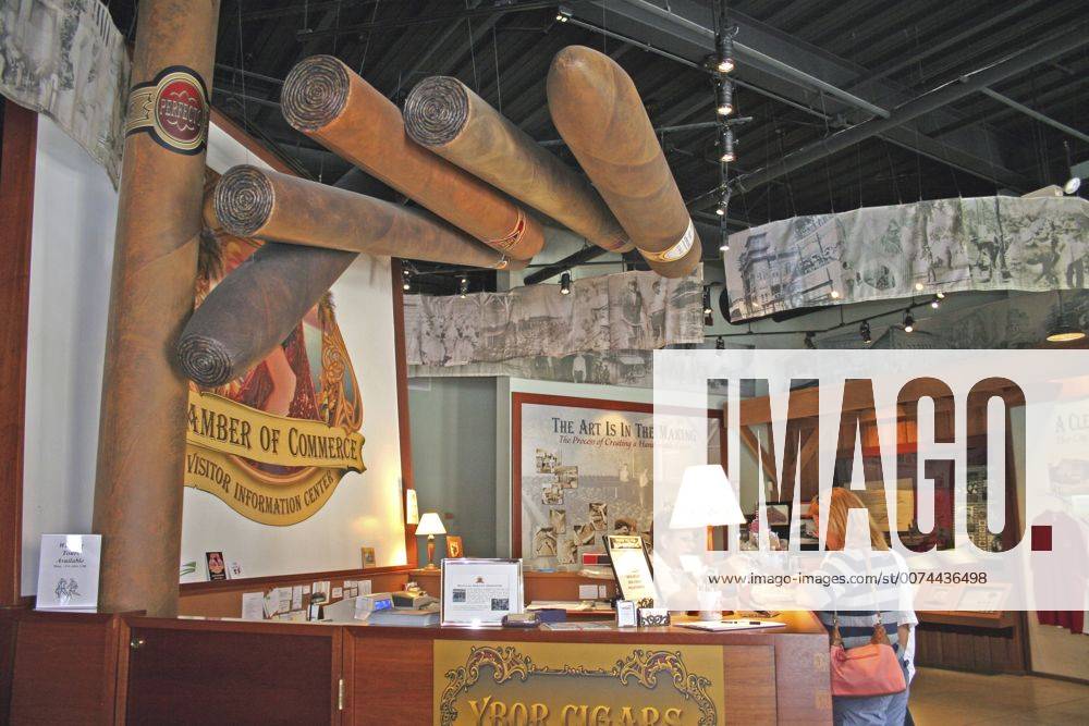 People under oversized cigars on ceiling Centro Museum historic Ybor ...