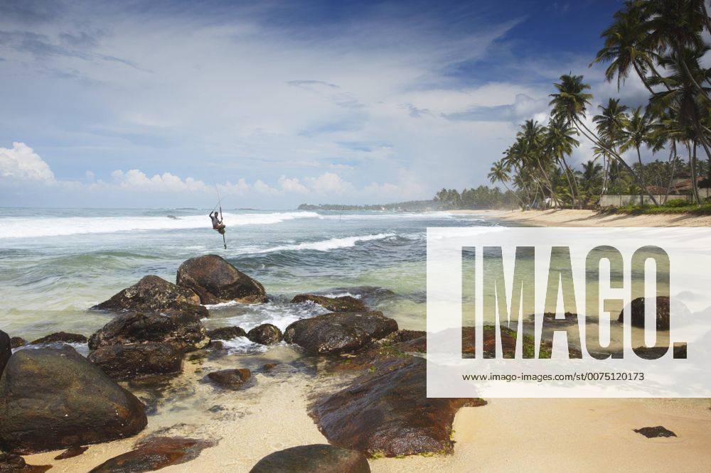 Stilt fisherman on Dalawela beach, Southern Province, Sri Lanka, Asia