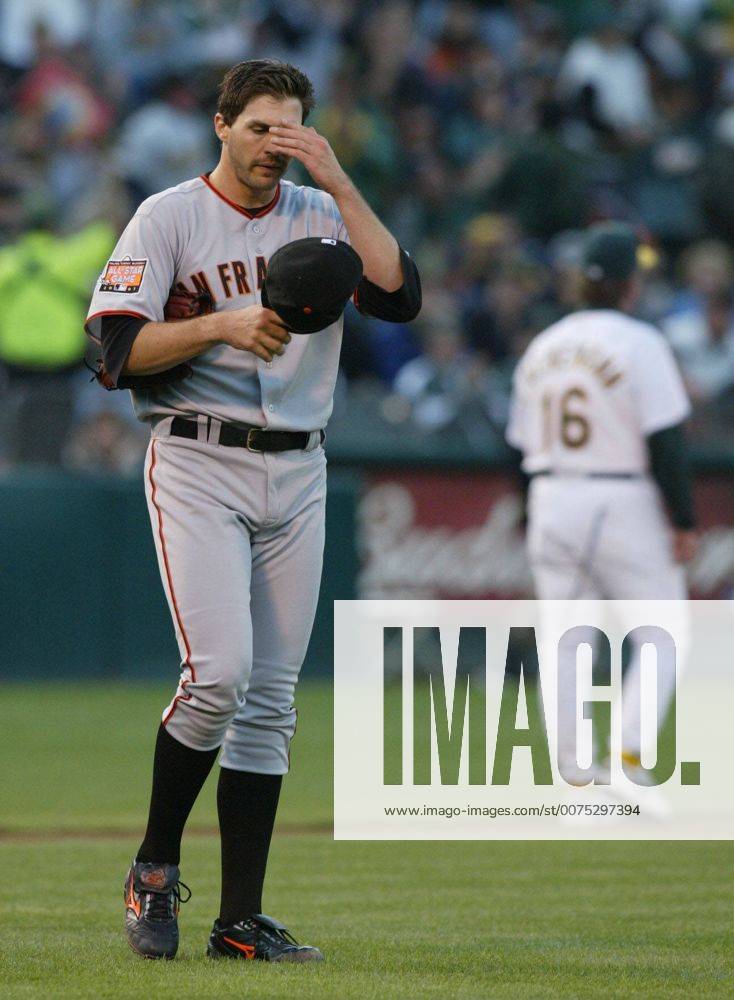 San Fransisco Pitcher Barry Zito heads back to mound after trying to ...