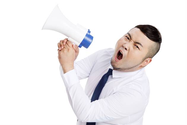 The fat man with a megaphone shouting business