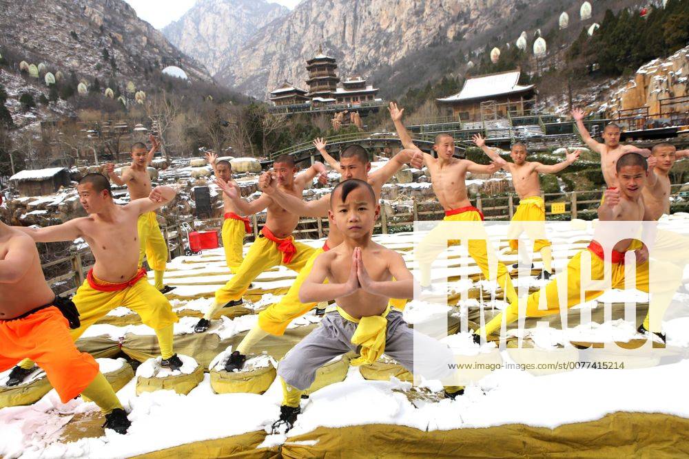 Dengfeng, China - Monks practice Kung Fu in snow at Shaolin Monastery in Song Mountain Dengfeng