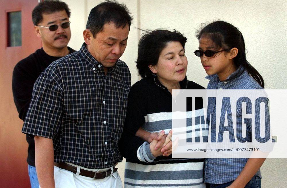 Family members of Ernesto Boom Bayuga III, left to right Fred Santos ...