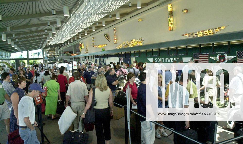 Air travelers queue their way to the check-in counter for Southwest ...