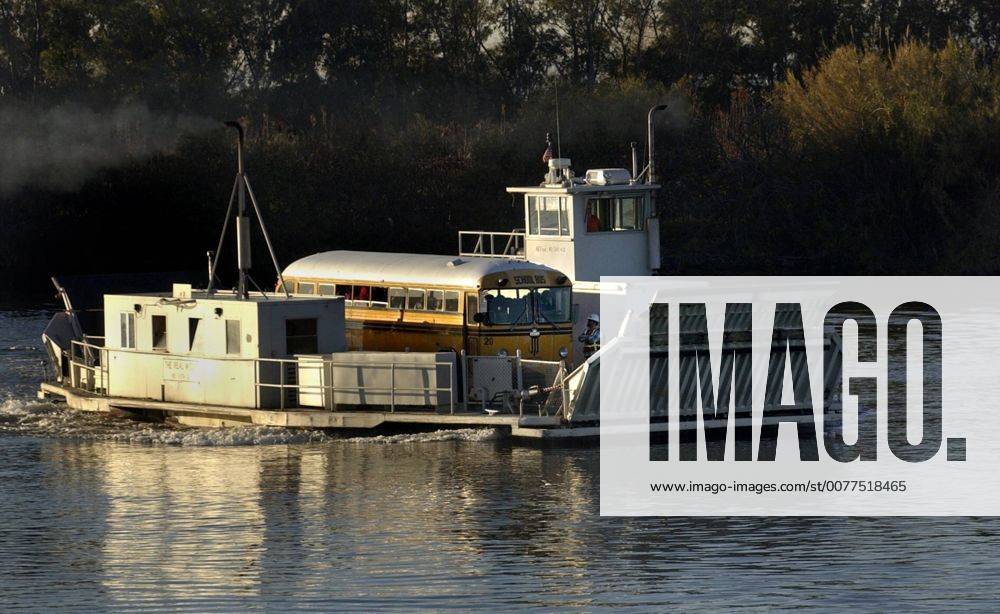 SECOND NEEDS 2 COL -- River Delta School bus 20 crosses over the river ...