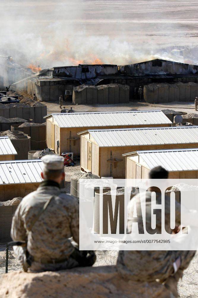 Nov 24, 2006; Rawah, IRAQ; Two US Marines sit on a hill at Combat ...