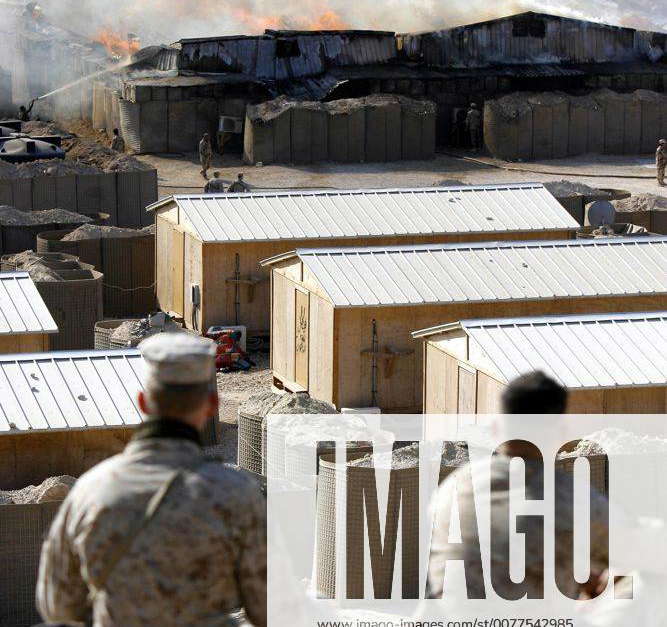 Nov 24, 2006; Rawah, IRAQ; Two US Marines sit on a hill at Combat ...