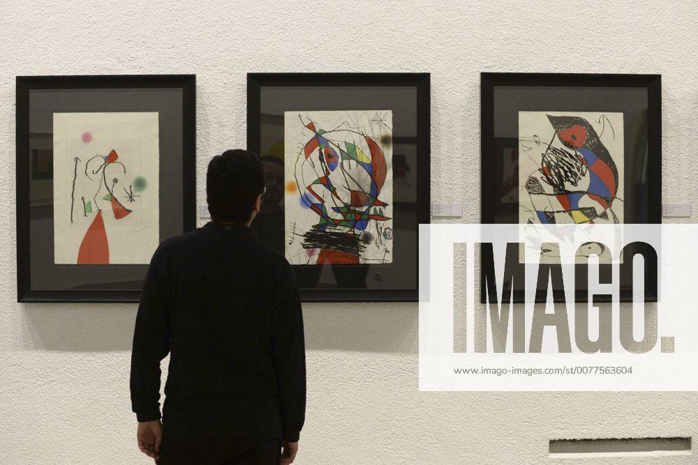 A visitor observes works by Spanish artist Joan Miro, as part of the ...