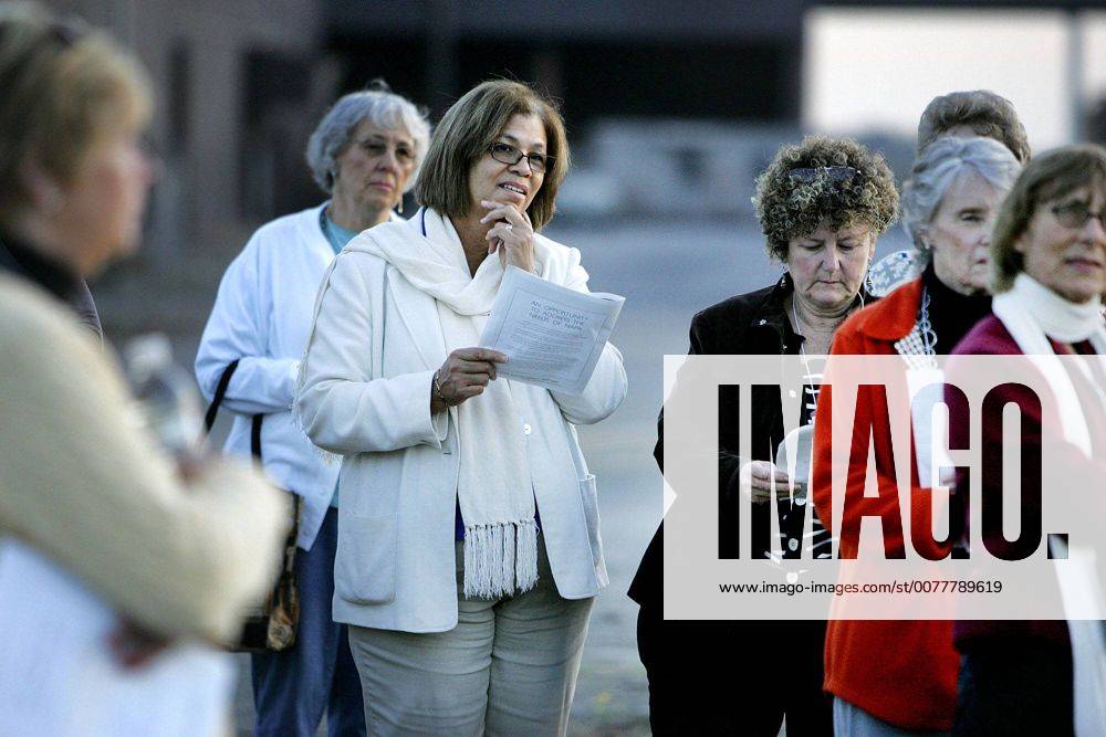 Sheila Cox listens to developer Keith Rogal during a public tour of ...