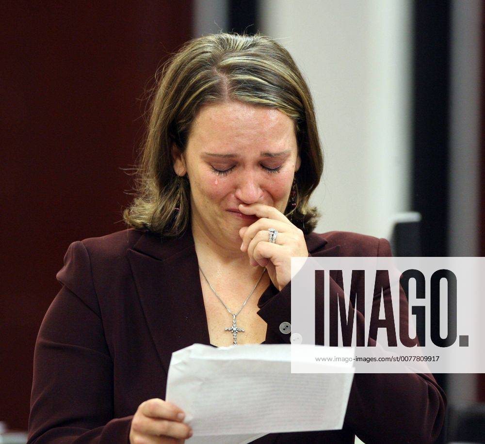 1 of 5.CAPTION : Former Wharton High School teacher and coach Jaymee Wallace sheds a tear as she