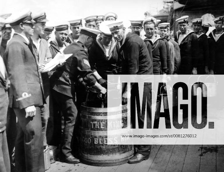 HMS Hood Sailors and officers line up on deck aboard HMS Hood to draw ...