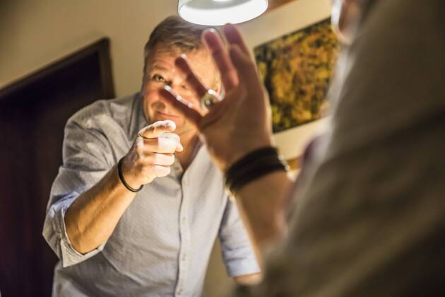 Symbol photo armed man and woman argue discuss controversial relationship